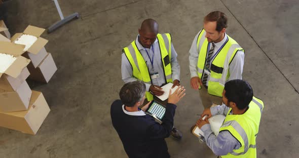 Staff meeting on the warehouse floor 4k, Stock Footage | VideoHive