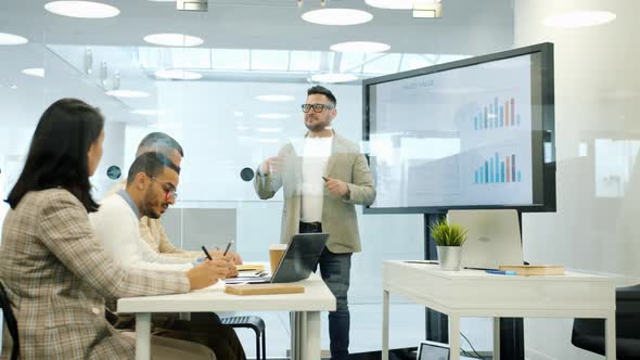 CEO Talking To Staff During Briefing Using Digital Interactive ...