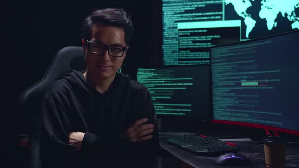 Asian Man Hacker Pose With Code On Multiple Computer Screens, Stock Footage