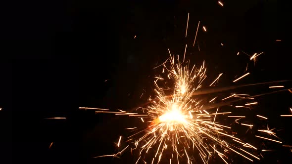 Handheld sparkle firework isolated on black. New year concept, Stock ...