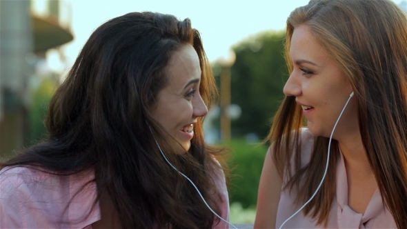 Two Girls Discussing Song, Stock Footage | VideoHive