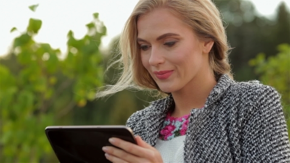 Portrait Of a Pretty Girl Using a Tablet, Stock Footage | VideoHive