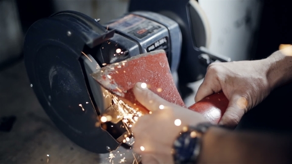 The Hands Of a Blacksmith Sharpening Axe, Stock Footage | VideoHive