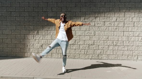Portrait of Attractive AfroAmerican Guy Dancing with Funny Face ...