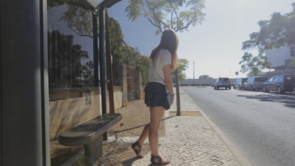 Lonely Young Girl Waiting Staying At Bus Stop In, Stock Footage | VideoHive