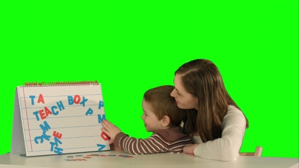 Mother And Son Make Word Mama On The Desk On a, Stock Footage | VideoHive