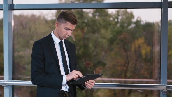Young Businessman Working With The Tablet, Stock Footage | VideoHive