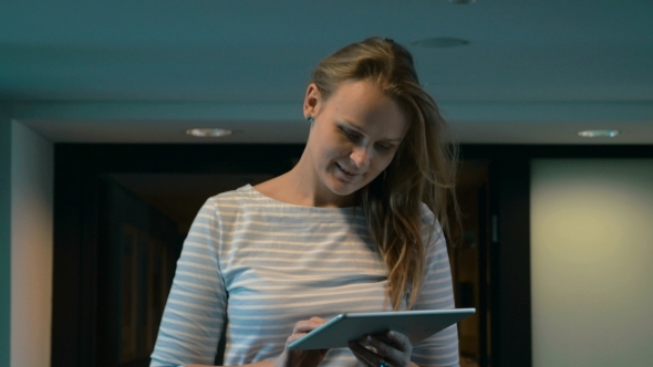 Woman Walking The Passage With Tablet In Hands, Stock Footage | VideoHive