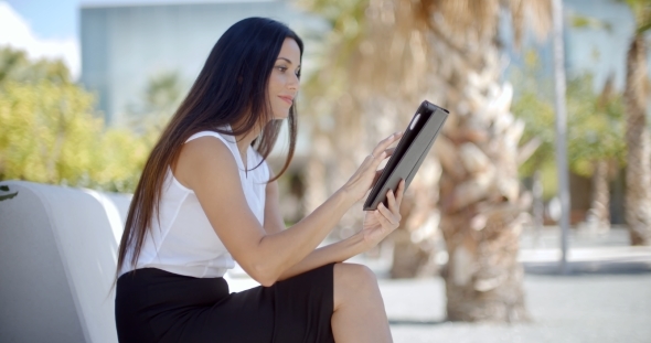 Smiling Young Woman Using Her Tablet Outdoors, Stock Footage | VideoHive
