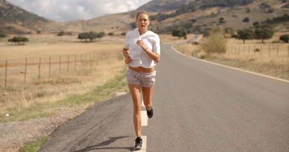 Fit Girl Running On Mountain Road, Stock Footage | VideoHive