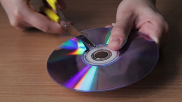 Cutting The Disc With Scissors, Stock Footage | VideoHive