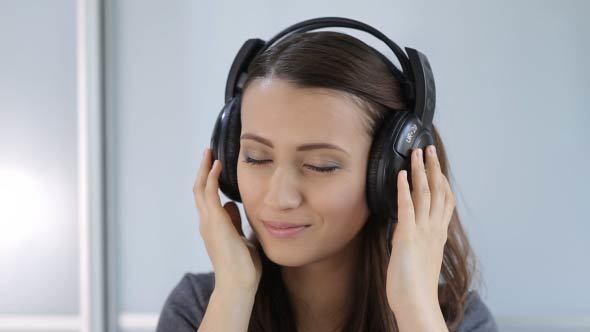 Woman Puts On, And Takes Off The Headphones, Stock Footage | VideoHive