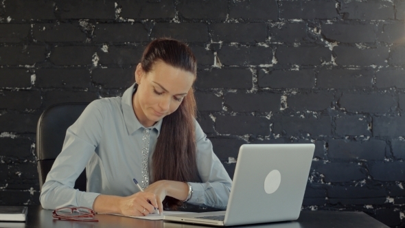 Businesswoman With Laptop Writes On a Document At, Stock Footage ...