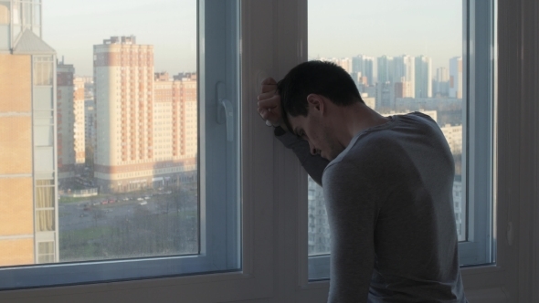 Worried Man Stand And Crying Near Window, Stock Footage | VideoHive