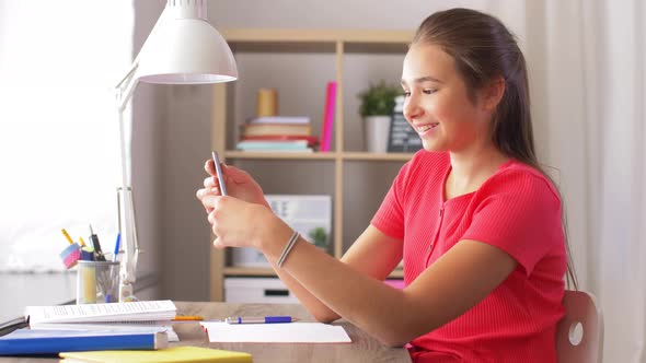 Girl with Smartphone Distracting From Homework, Stock Footage | VideoHive