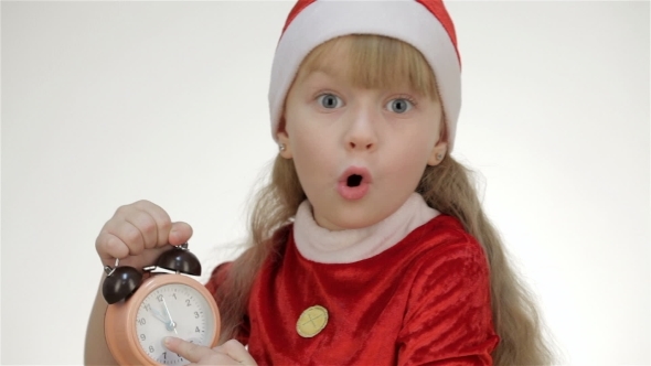 Kid Girl Looking At The Clock And Wondering, Stock Footage | VideoHive