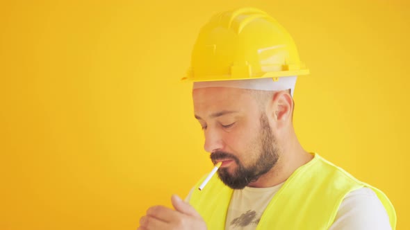 Portrait of a Warehouse Worker or Construction Worker Smoking a ...