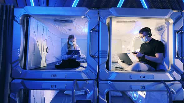 Guests of a Pod Hotel Wearing Face Masks Inside of the Capsules, Stock ...