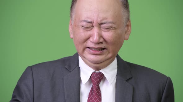 Mature Sad Japanese Businessman Crying While Covering Eyes, Stock Footage