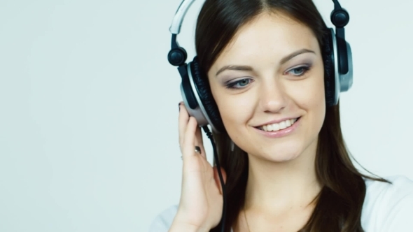 The Brunette Takes Off The Headphones: Smiles, Stock Footage | VideoHive