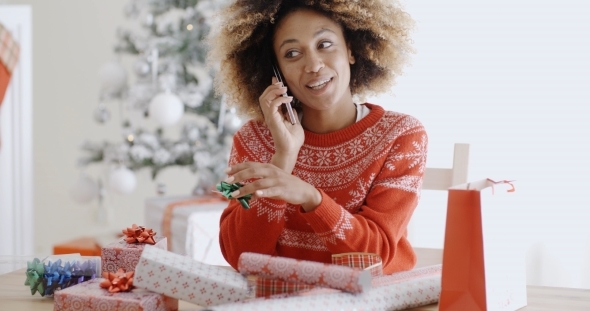 Woman Chatting On a Mobile As She Wraps Gifts, Stock Footage | VideoHive