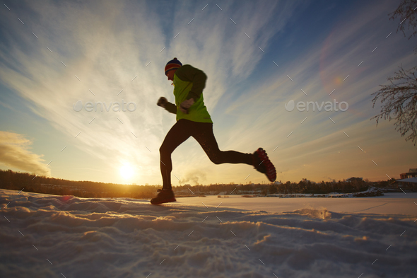 Running in winter Stock Photo by Pressmaster | PhotoDune