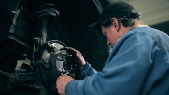 Mechanic Inspecting Car Brake Discs, Stock Footage | VideoHive