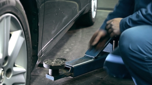 Mechanic Going To Raise Vehicle On The Car Lift, Stock Footage | VideoHive