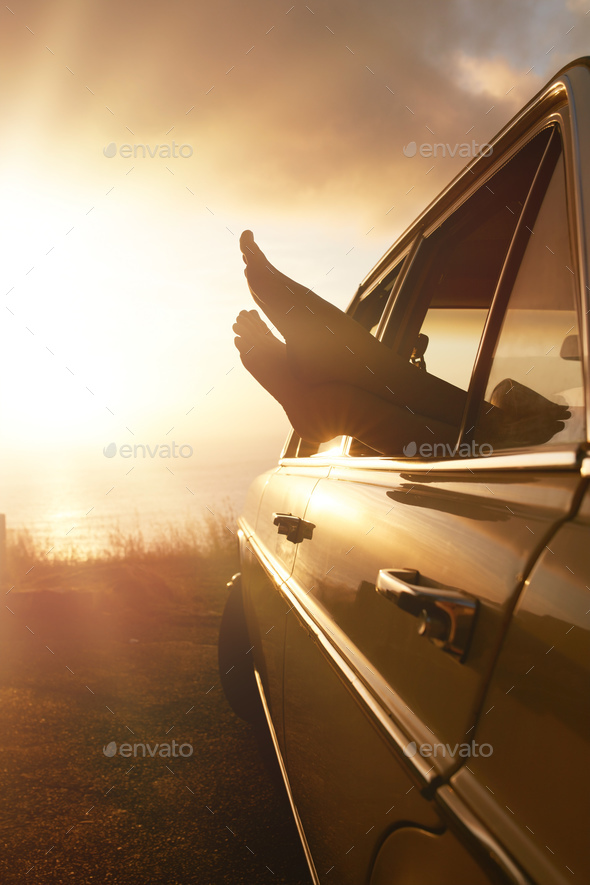 Woman feet out of car window Stock Photo by jacoblund | PhotoDune