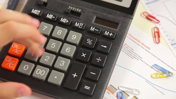 Businessman Counting On a Calculator, Stock Footage | VideoHive