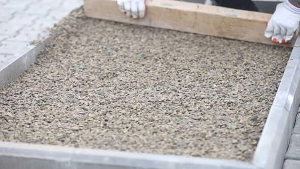 Leveling Gravel a Wooden Board, Stock Footage | VideoHive