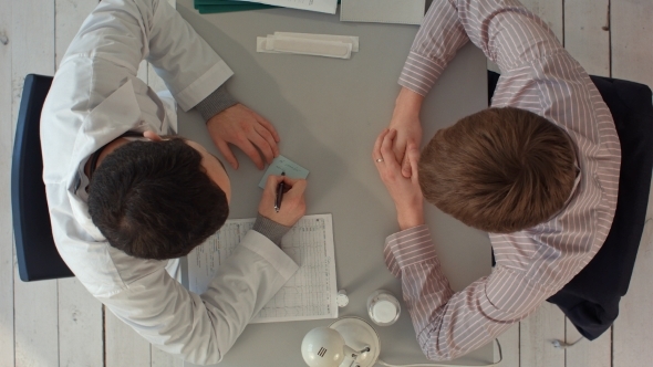 Doctor Writing On a Medical Chart, Stock Footage | VideoHive