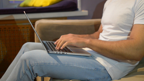 Relaxing Man Typing on Laptop in Lap, Stock Footage | VideoHive