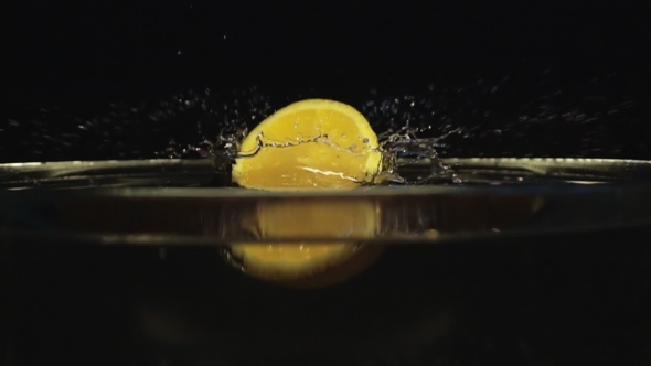 Half Lemon Drop On Water With Splash, Stock Footage | VideoHive