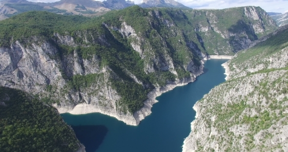 Aerial View Of Famous Piva Canyon With Its Fantastic Reservoir In ...