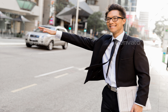 Waving for a taxi in city Stock Photo by nexusplexus | PhotoDune