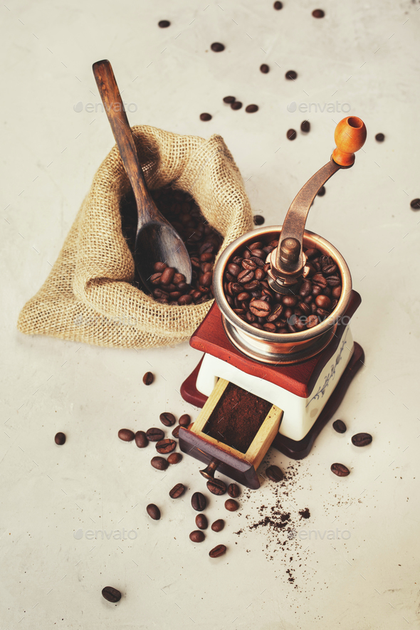 Grinder and a bag of coffee beans. Stock Photo by Vell | PhotoDune