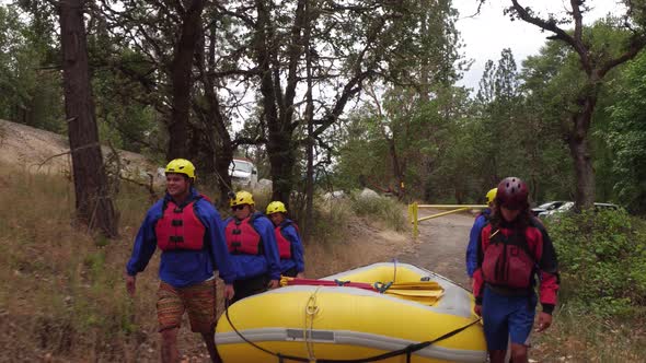 Group of people white water rafting carry raft together, Stock Footage