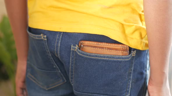 Young Man Taking Wallet Out From Back Pocket, Stock Footage | VideoHive