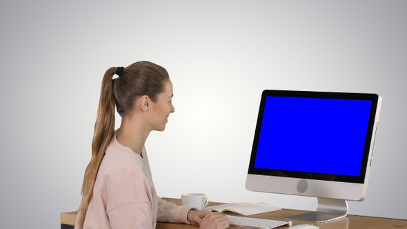 Girl Sitting in Front of The Computer Monitor and Watching, Stock Footage