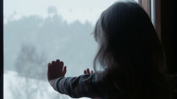 Little Cute Girl Behind Window In Winter, Stock Footage | VideoHive