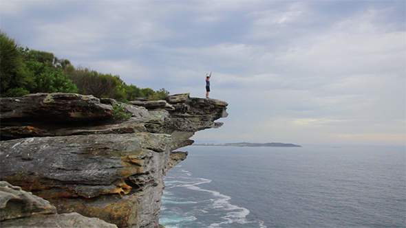 Lone Man Running on Cliff, Stock Footage | VideoHive