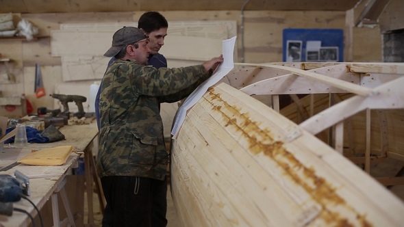 Carpenter Explains to a Colleague the Details of the Draft of the Boat ...