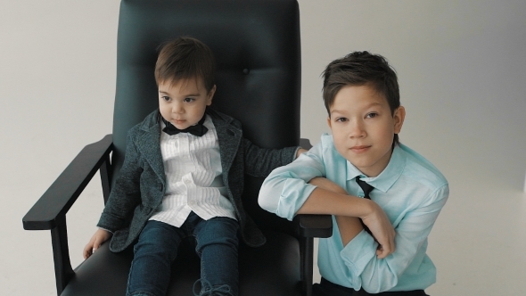 Portrait Of Two Cute European Boys. Two Brothers. Older Brother Hugs ...