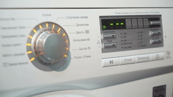 Woman Chooses Program Cycle On a Washing Machine, Stock Footage | VideoHive