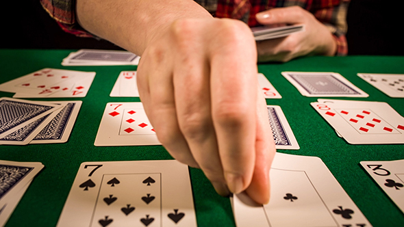 Female Hands Holding Cards And Playing Solitaire, Stock Footage | VideoHive