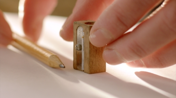 Man Taking Pencil Sharpener And Graphite Pencil, Stock Footage | VideoHive