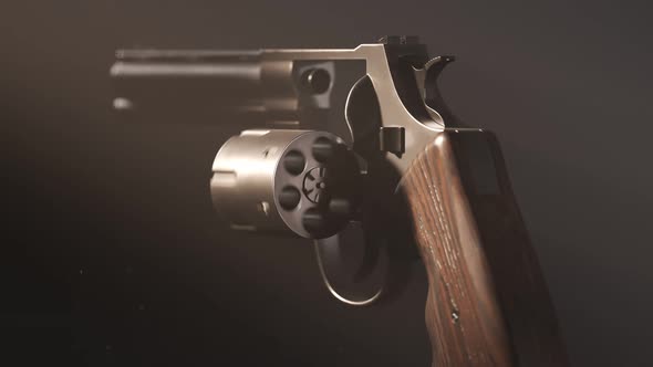 Revolver with spinning cylinder holding one bullet. Playing russian ...