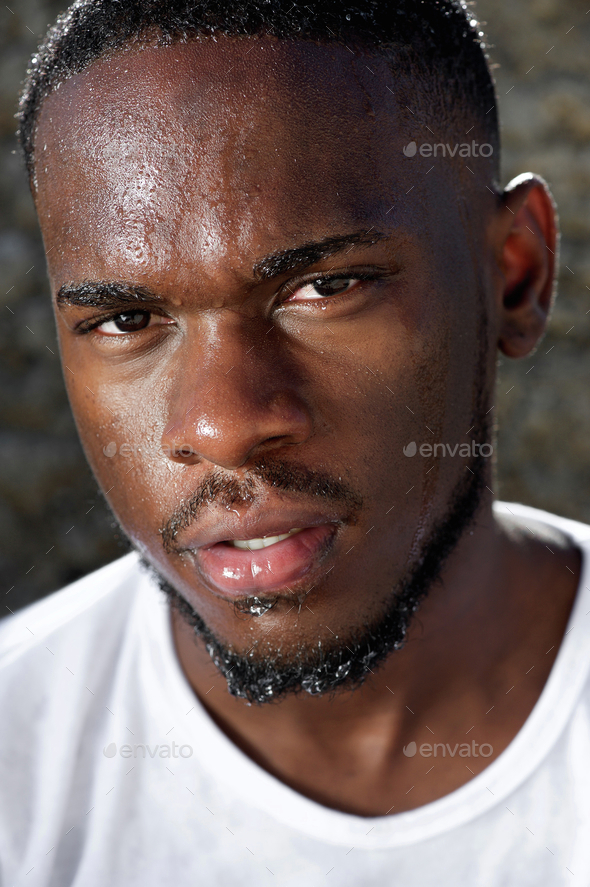 Handsome young black man with sweat dripping down face Stock Photo by ...
