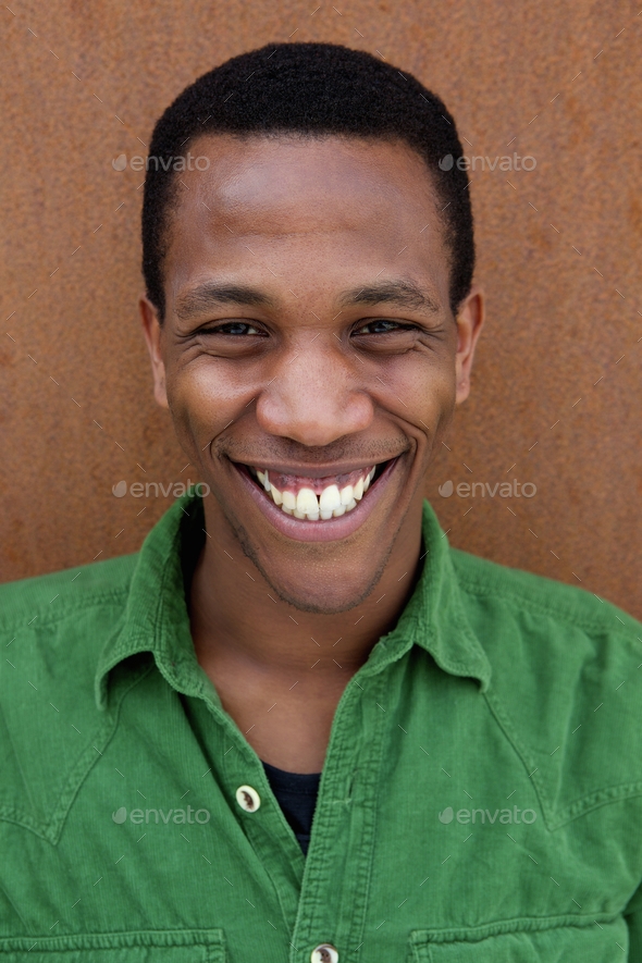 Smiling young african man Stock Photo by mimagephotography | PhotoDune